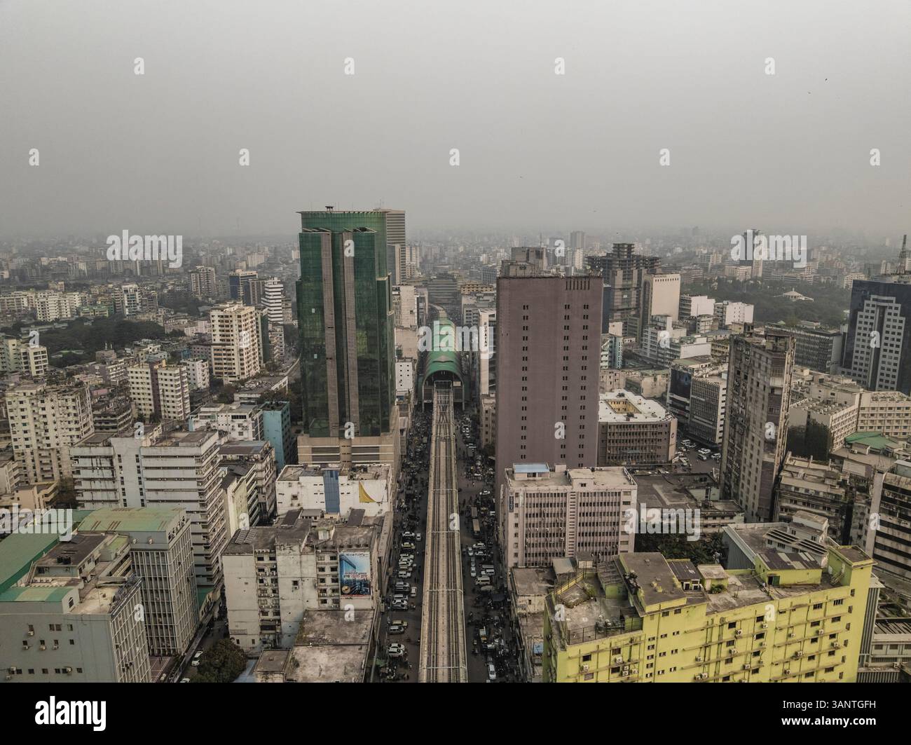Aerial view of bustling urban landscape with skyscrapers and railway ...