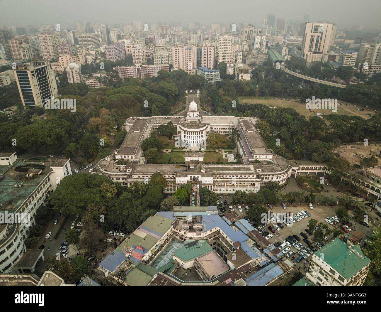 Aerial view of bustling cityscape with modern buildings, greenery, and ...