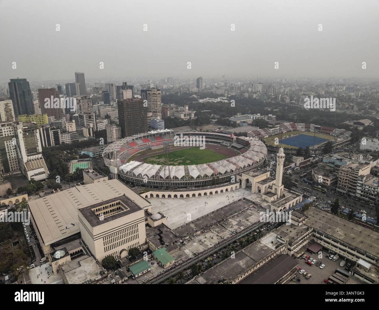 Aerial view of bangladesh national stadium surrounded by busy urban ...