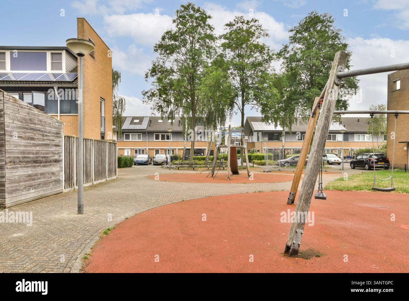 A well-designed playground featuring swings and playground equipment ...