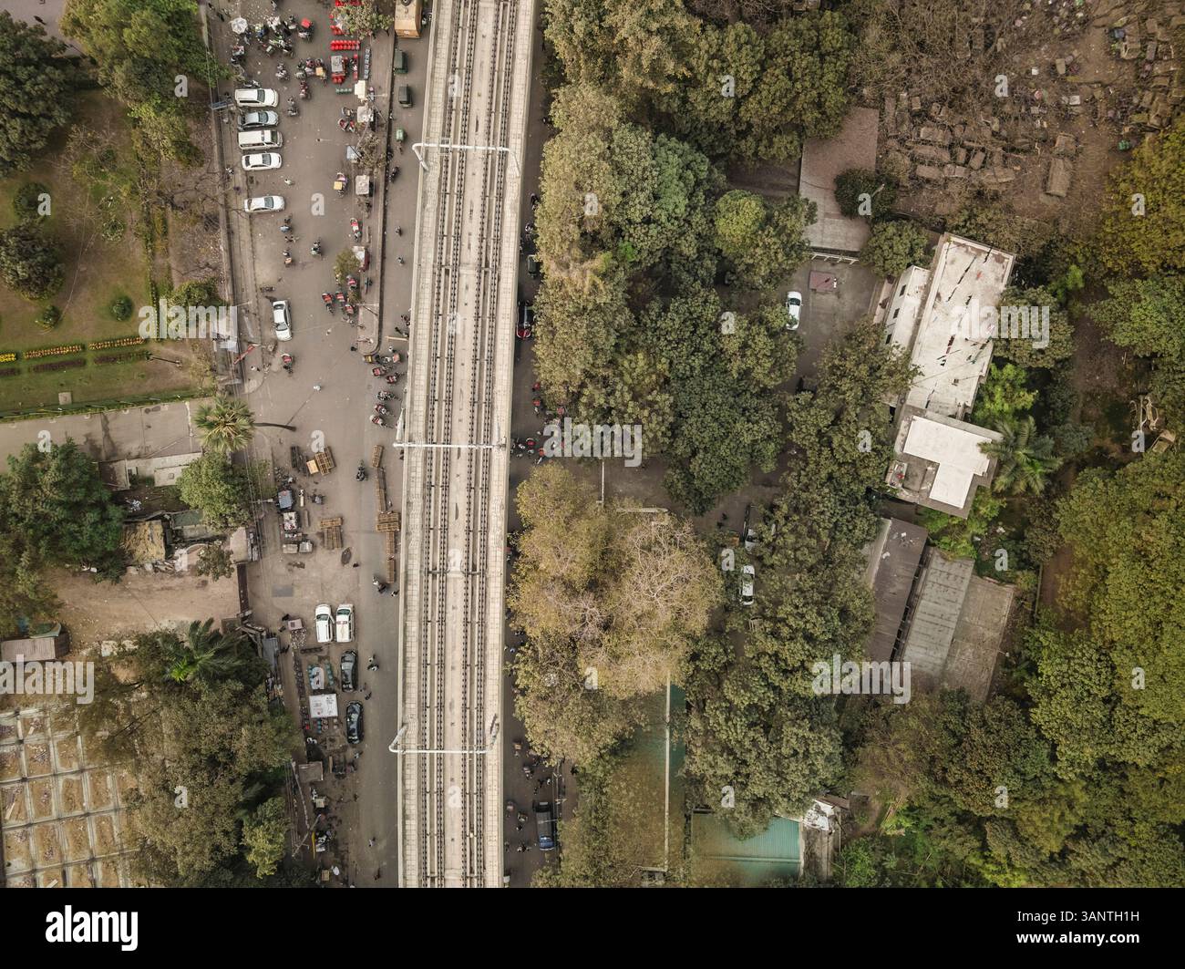 Aerial view of busy railway and urban landscape with buildings and ...