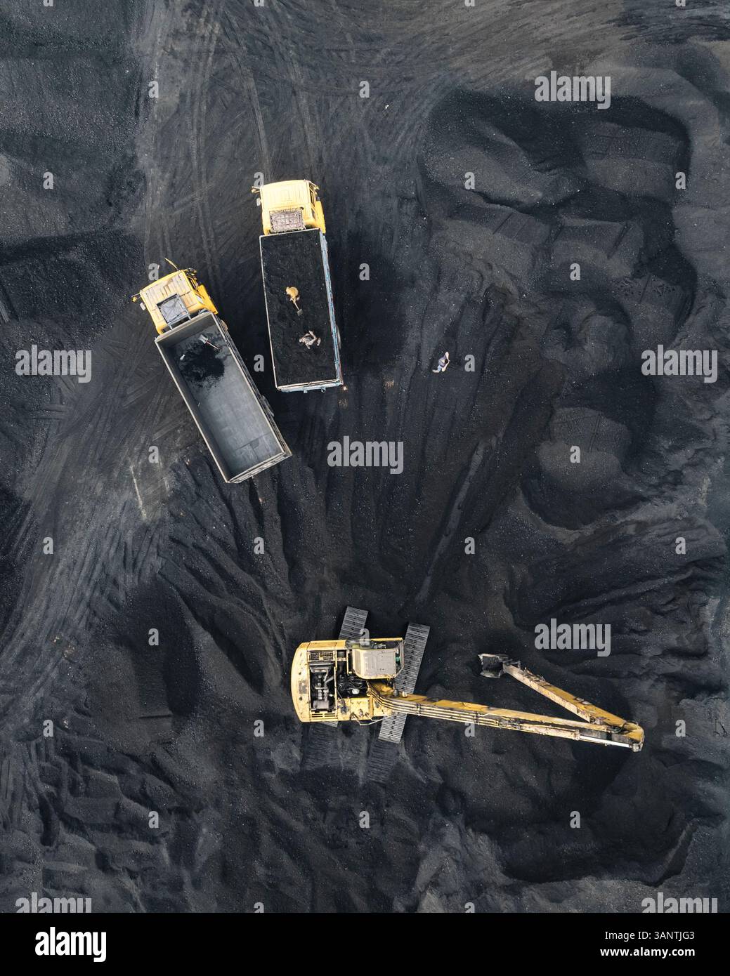 Aerial view of industrial coal factory with cranes and excavators in ...
