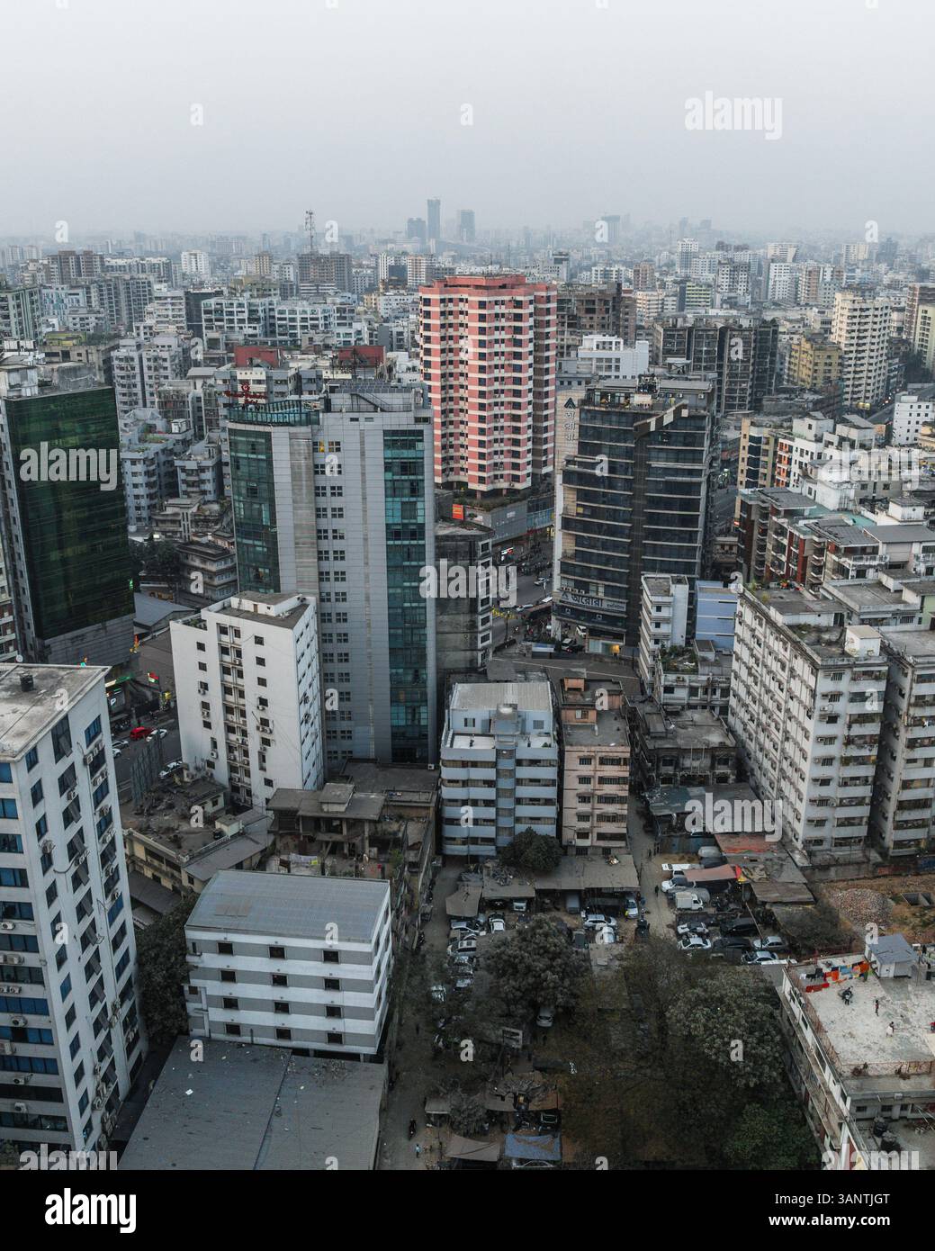 Aerial view of bustling cityscape with high rise buildings and dense ...