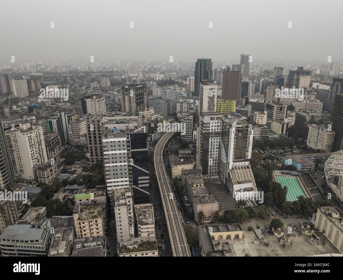 Aerial view of bustling cityscape with modern skyscrapers and railway ...