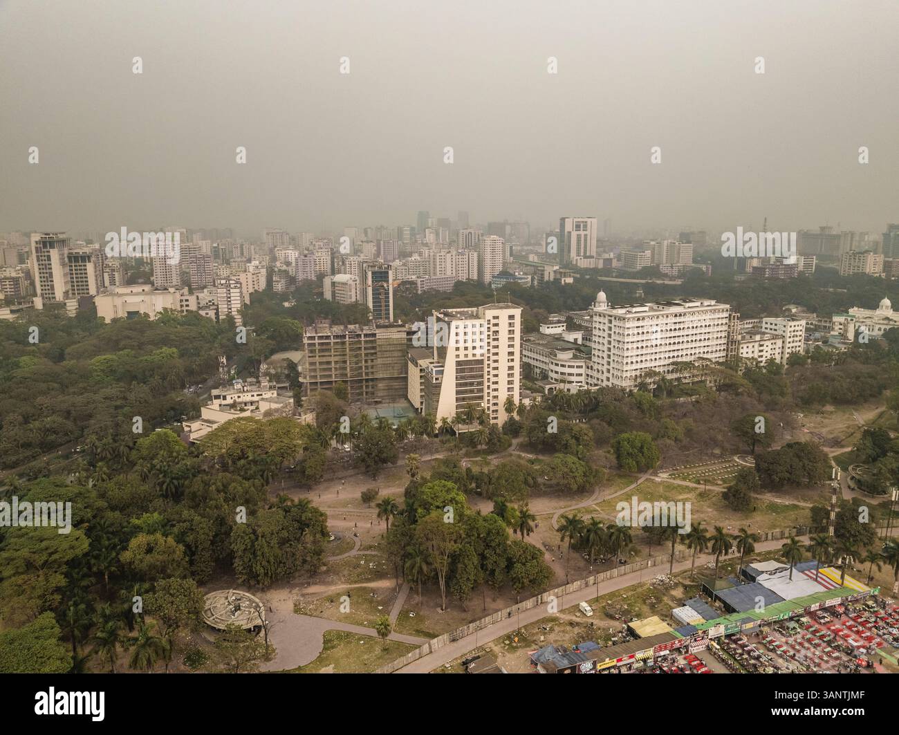Aerial view of bustling urban cityscape with high-rise buildings, green ...