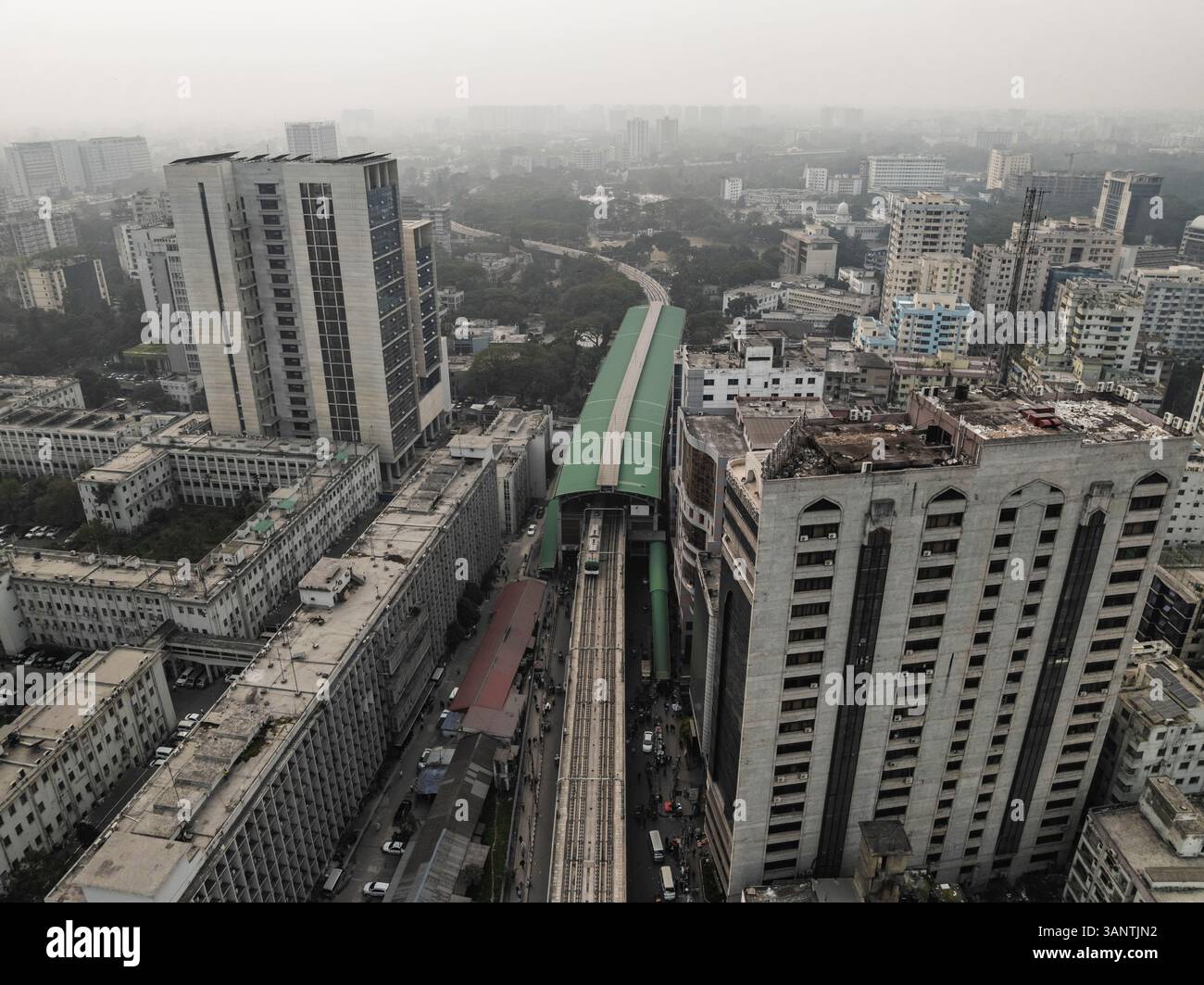 Aerial view of bustling cityscape with high-rise buildings and railway, Shahbag, Dhaka ...