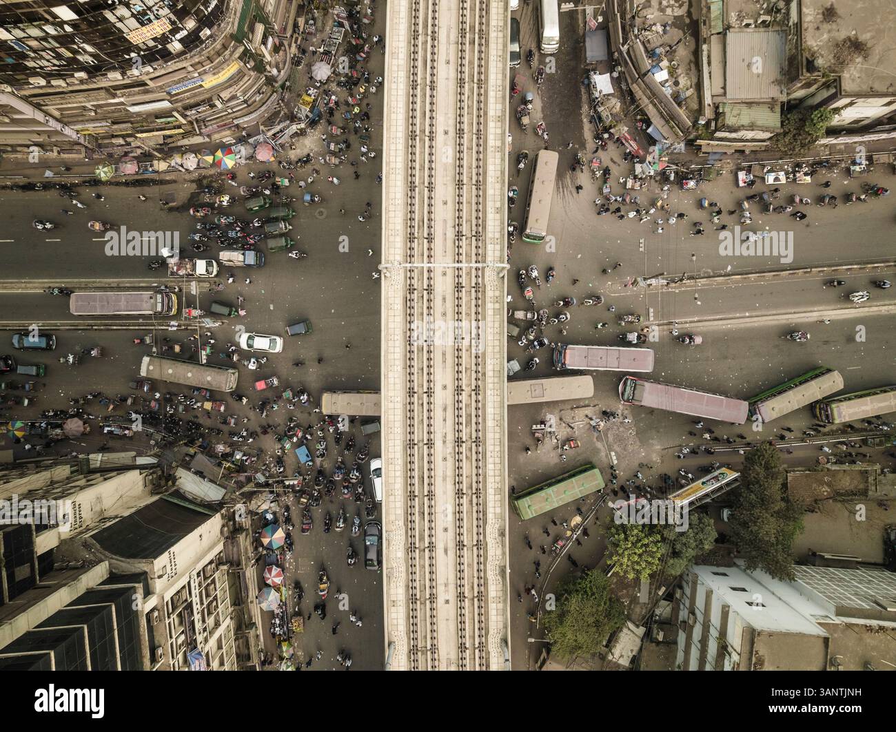 Aerial view of busy railway intersection with bustling urban landscape ...