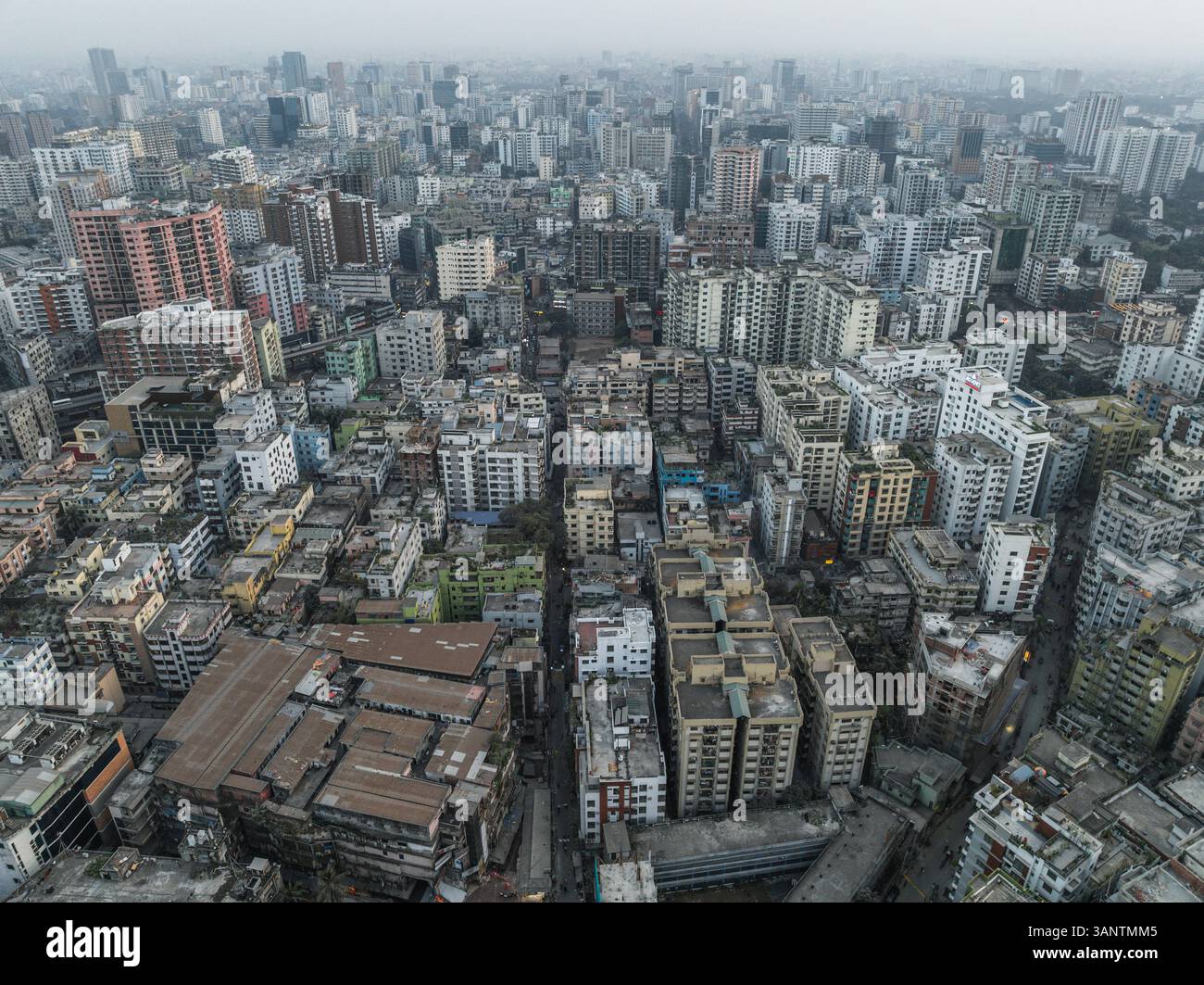 Aerial view of bustling cityscape with modern skyscrapers and dense ...
