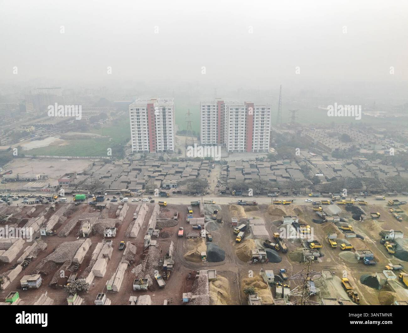 Aerial view of cement industries and high-rise buildings in an urban ...
