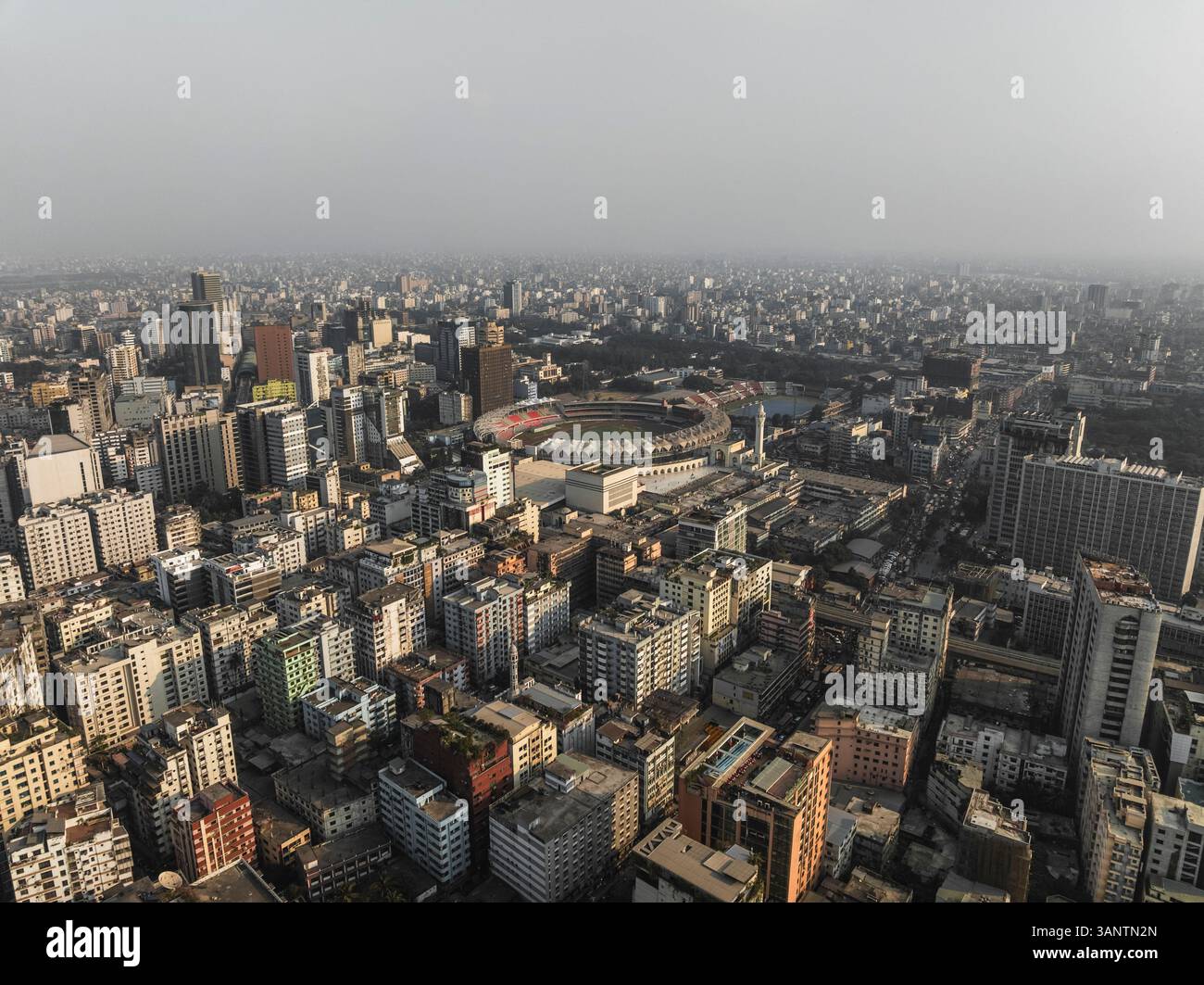 Aerial view of the dense urban cityscape featuring modern skyscrapers and the Bangabandhu ...
