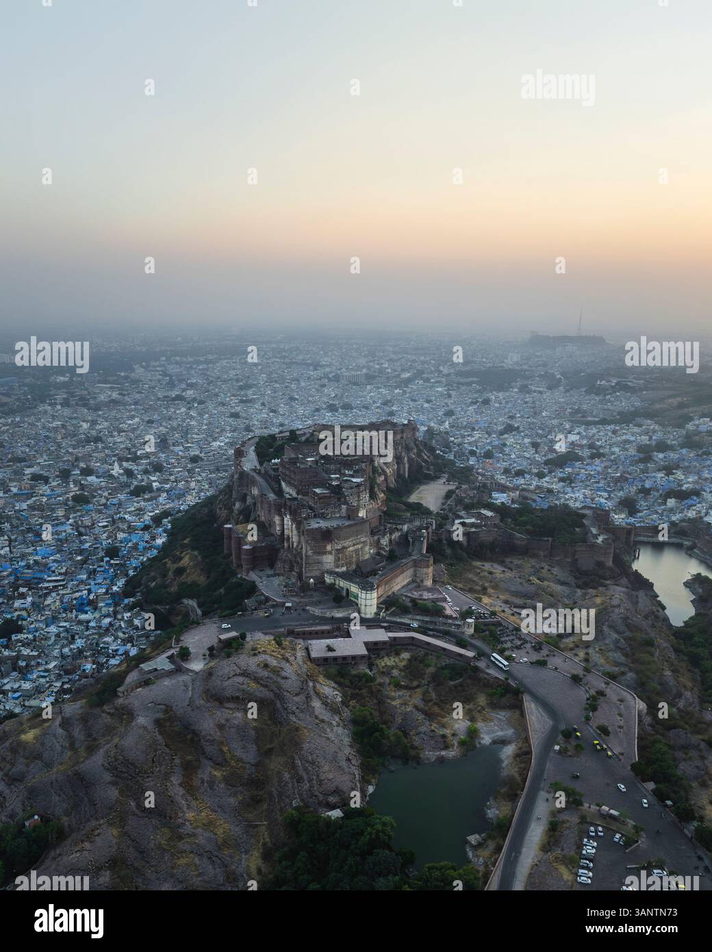 Aerial view of mehrangarh fort at sunset overlooking the vibrant blue ...