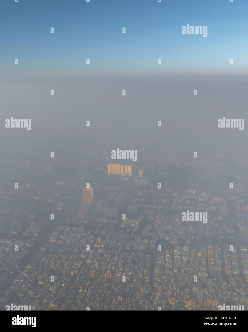 Aerial view of a sprawling urban skyline with modern buildings under a ...