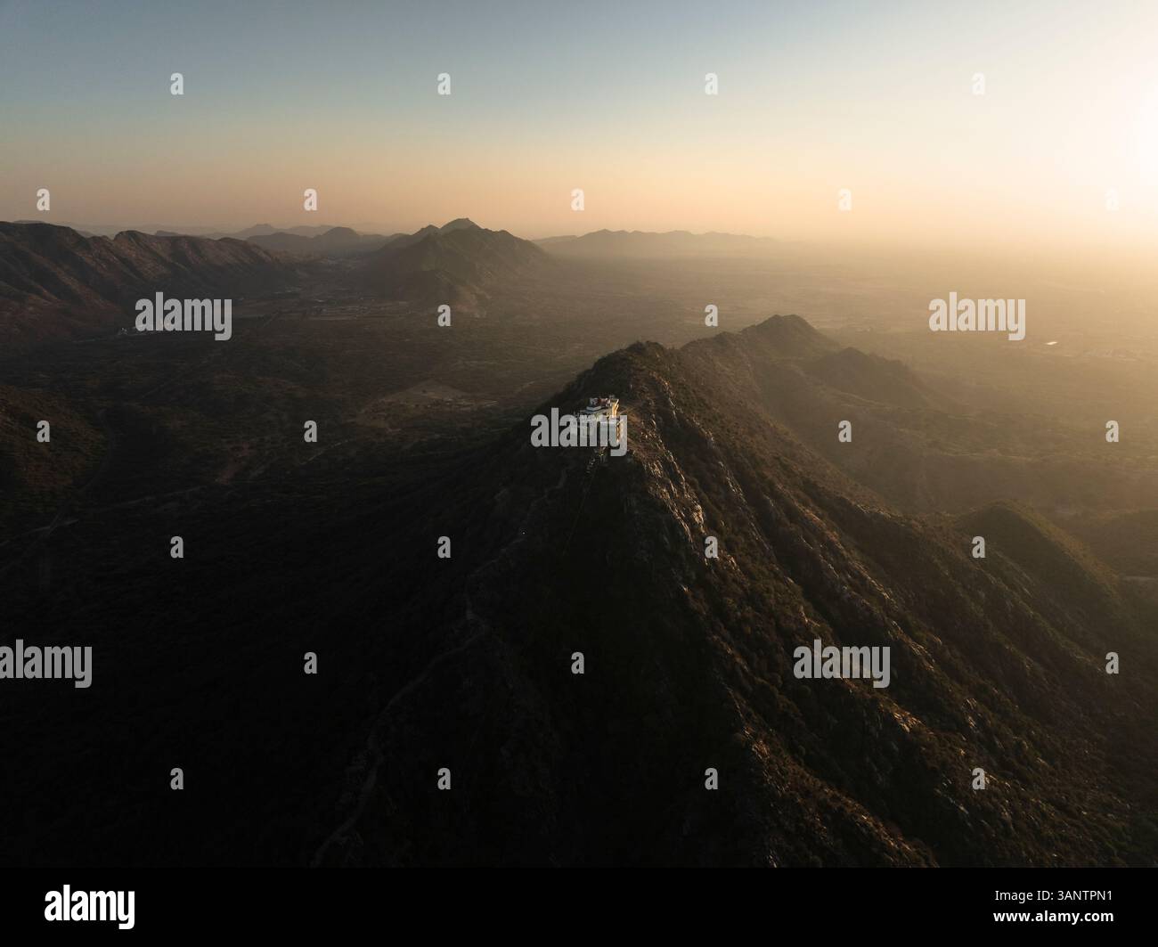 Aerial view of Shree Savitri Mata Temple on a mountain at sunset ...