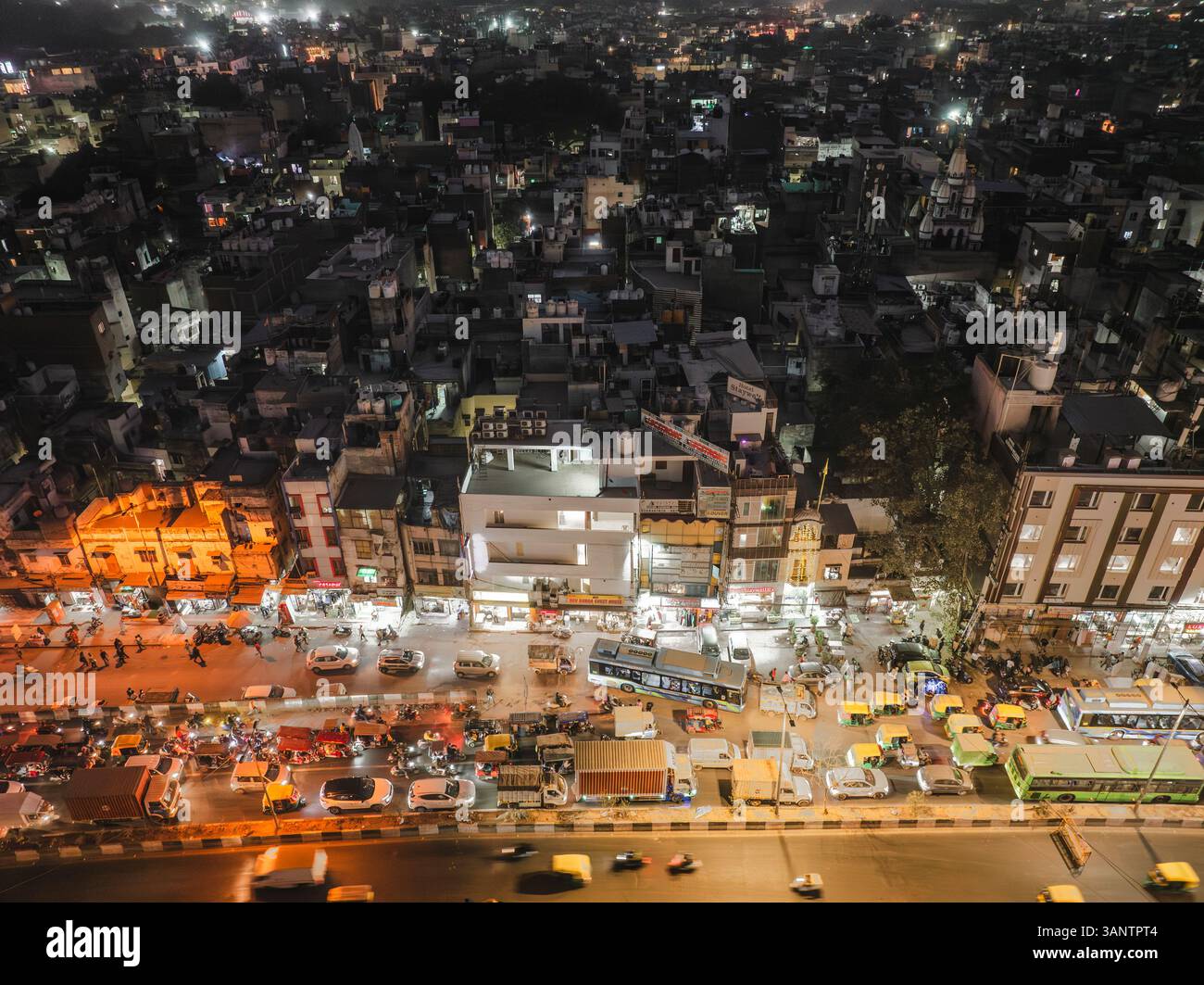 Aerial view of bustling cityscape with vibrant lights and busy streets ...