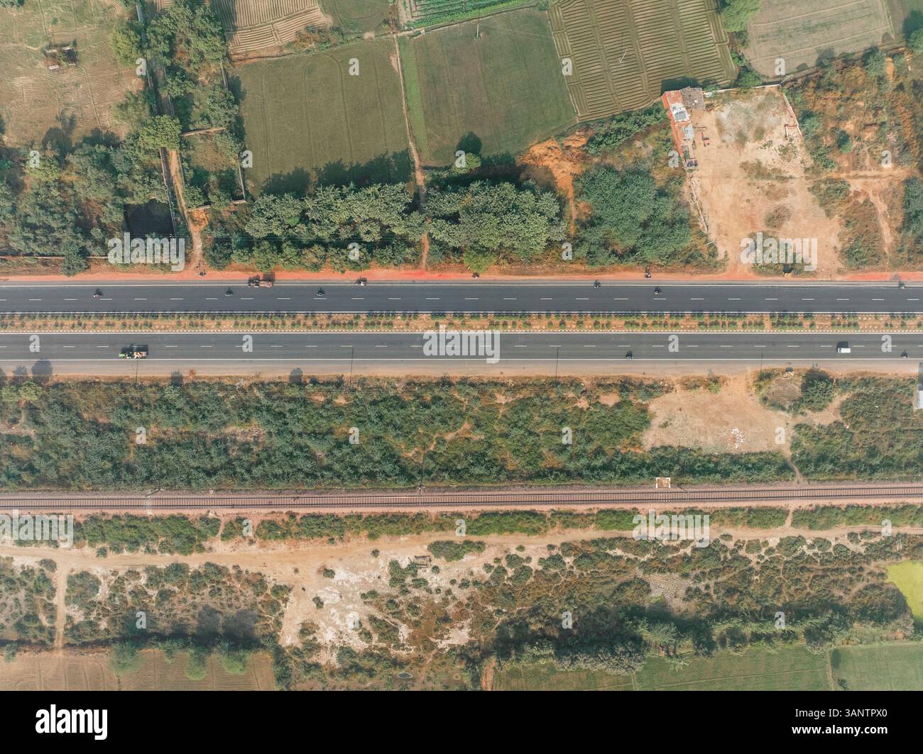 Aerial view of beautiful expressway surrounded by scenic fields and ...