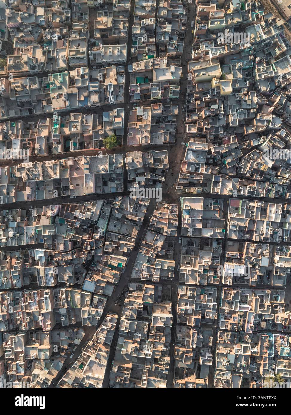 Aerial view of densely packed rooftops and chaotic streets in a ...
