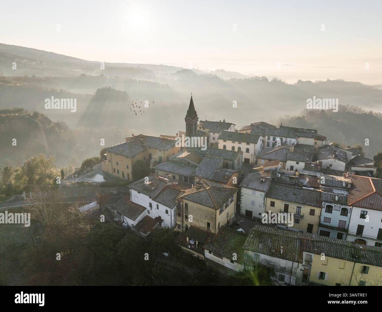 Aerial view of a picturesque village with stone buildings and a church ...