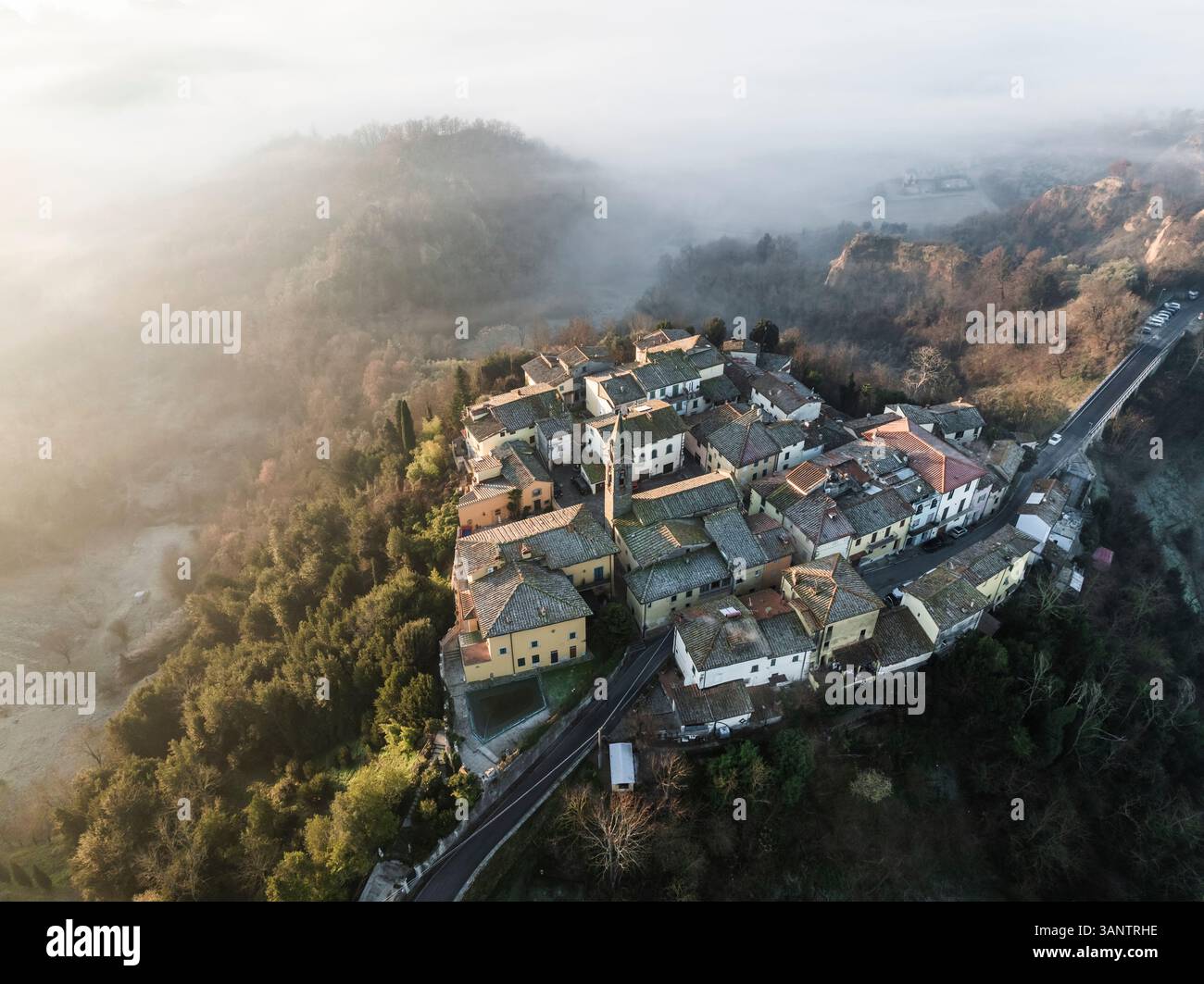 Aerial view of balze valdarno village shrouded in fog and mist at ...