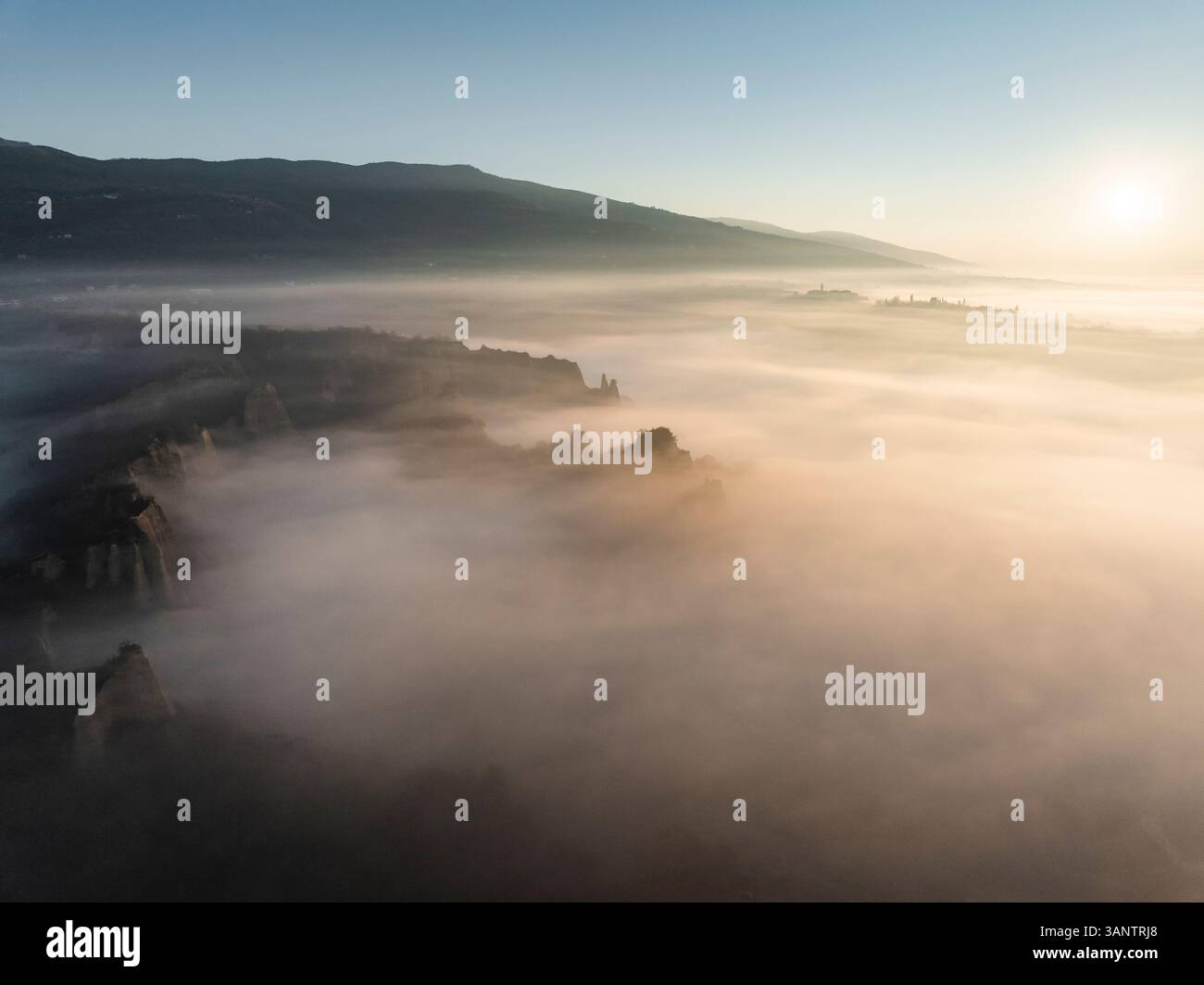 Aerial view of balze valdarno landscape with fog and mist at sunrise ...