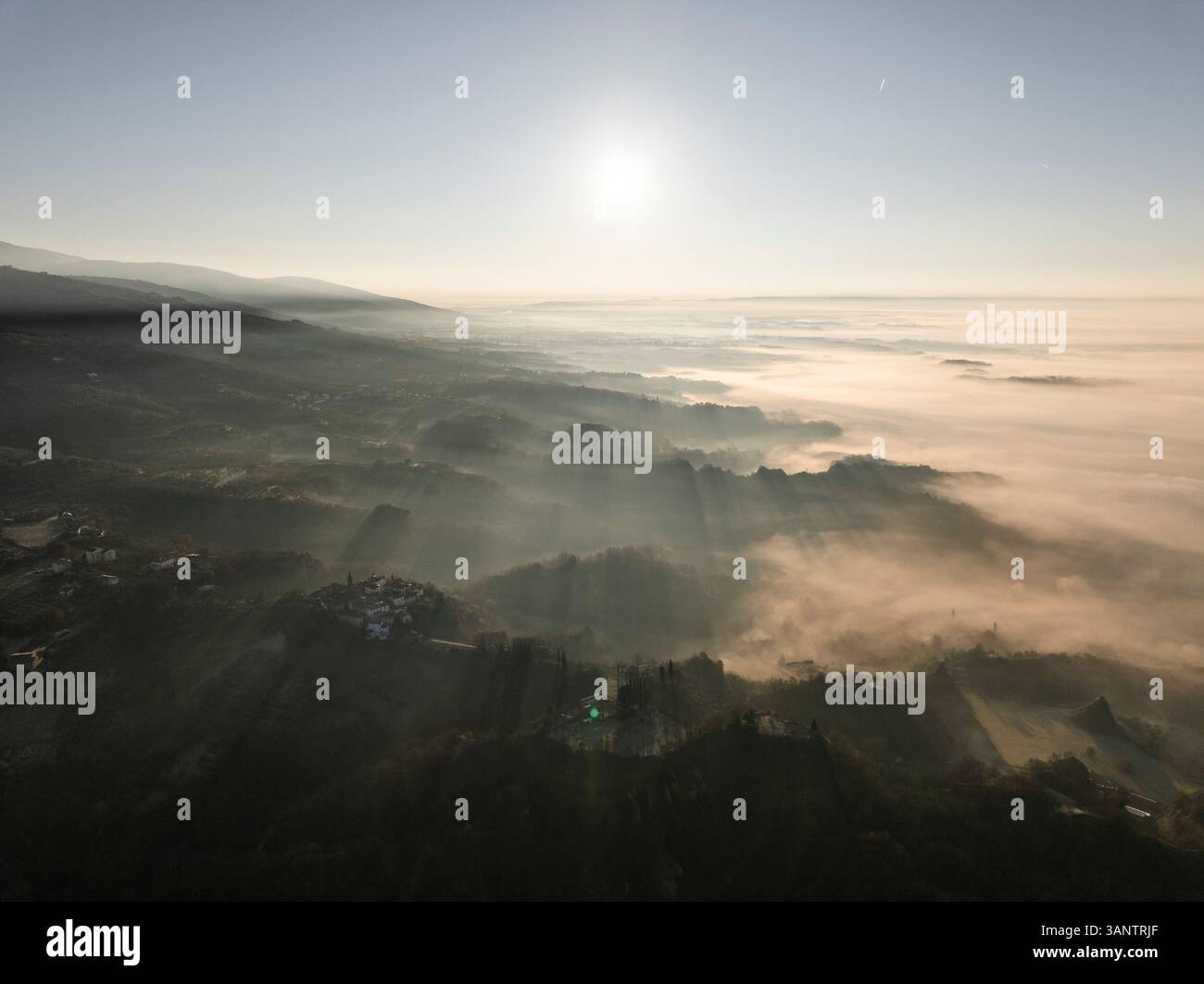 Aerial view of balze valdarno valley shrouded in fog and mist during ...