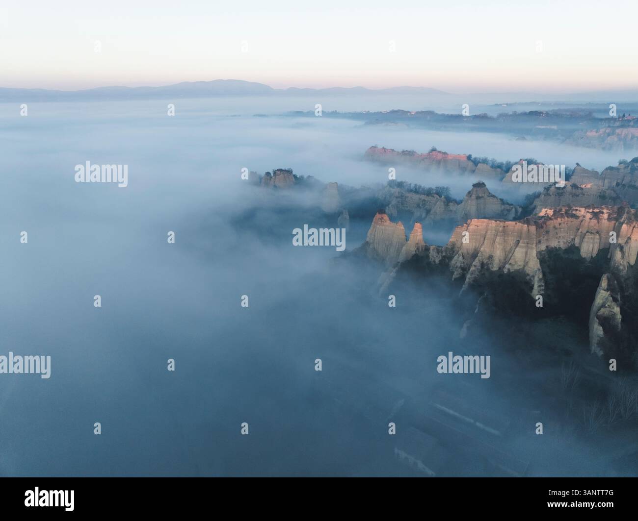 Aerial view of balze valdarno valley with fog and mist at sunrise ...