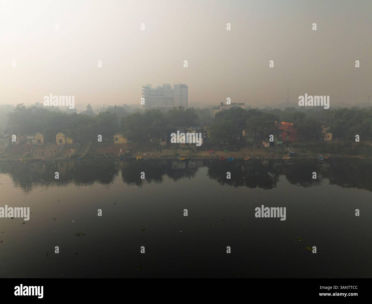 Aerial view of tranquil Yamuna Ghat with beautiful reflections on the ...