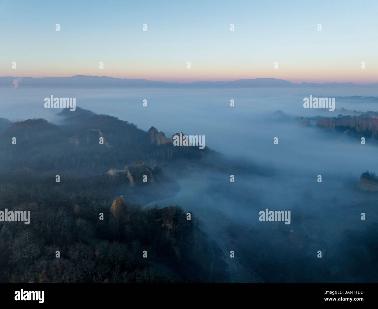 Aerial view of balze valdarno landscape shrouded in fog and mist at ...