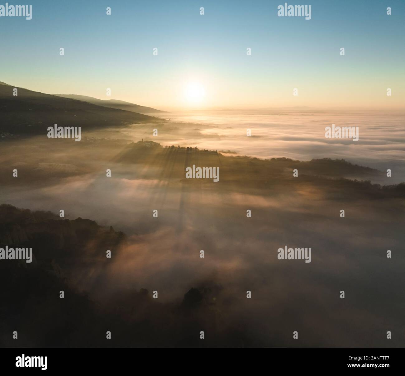 Aerial view of balze valdarno landscape at sunrise with fog and mist ...