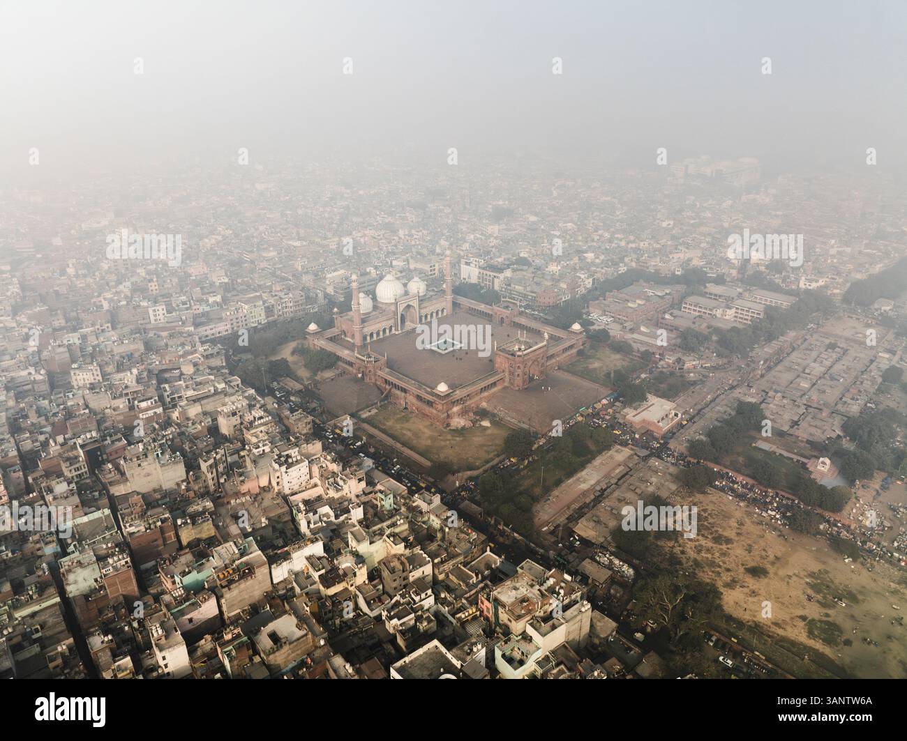 Aerial view of bustling historic Jama Masjid and vibrant cityscape in ...