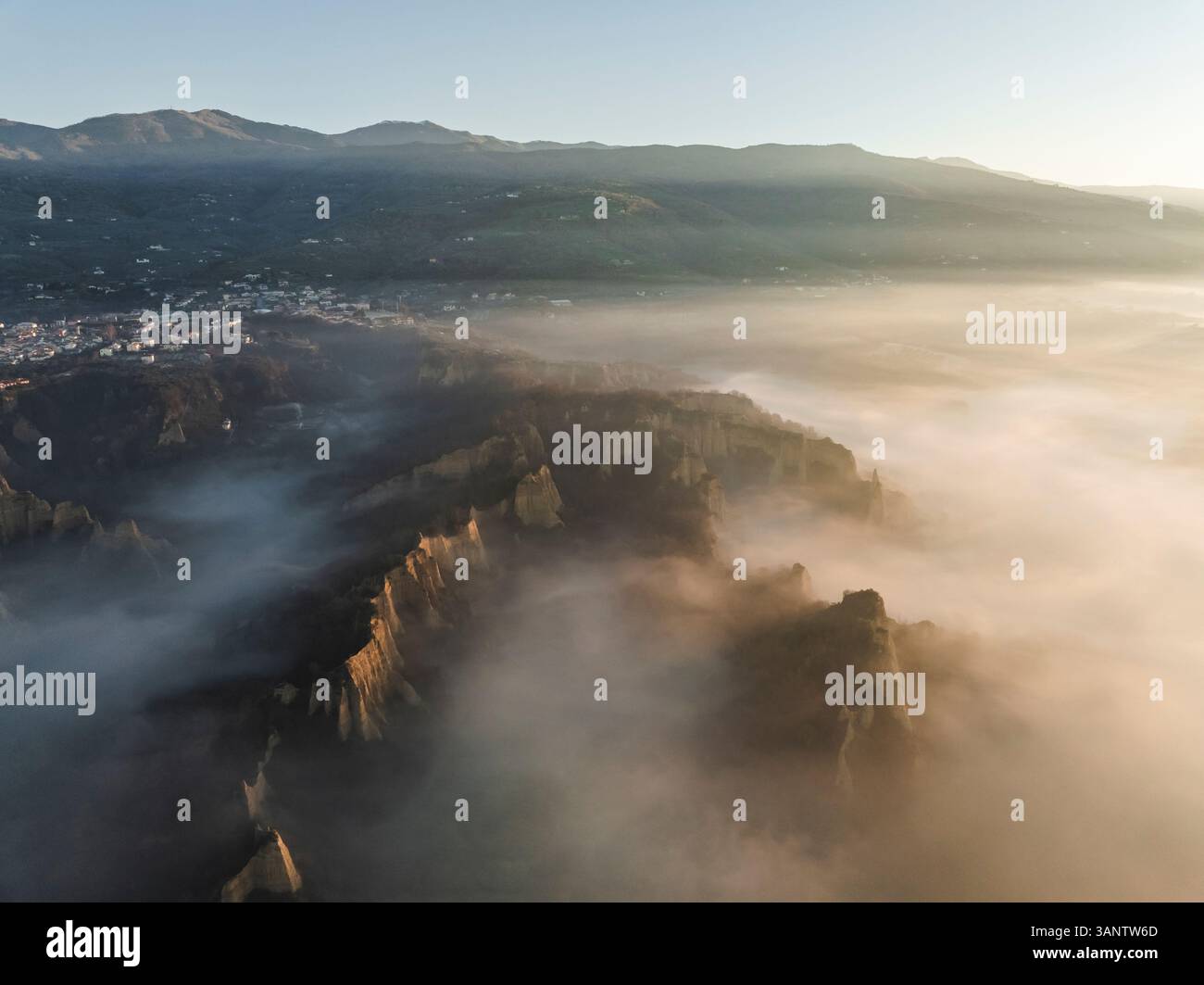 Aerial view of balze valdarno valley shrouded in fog and mist during ...