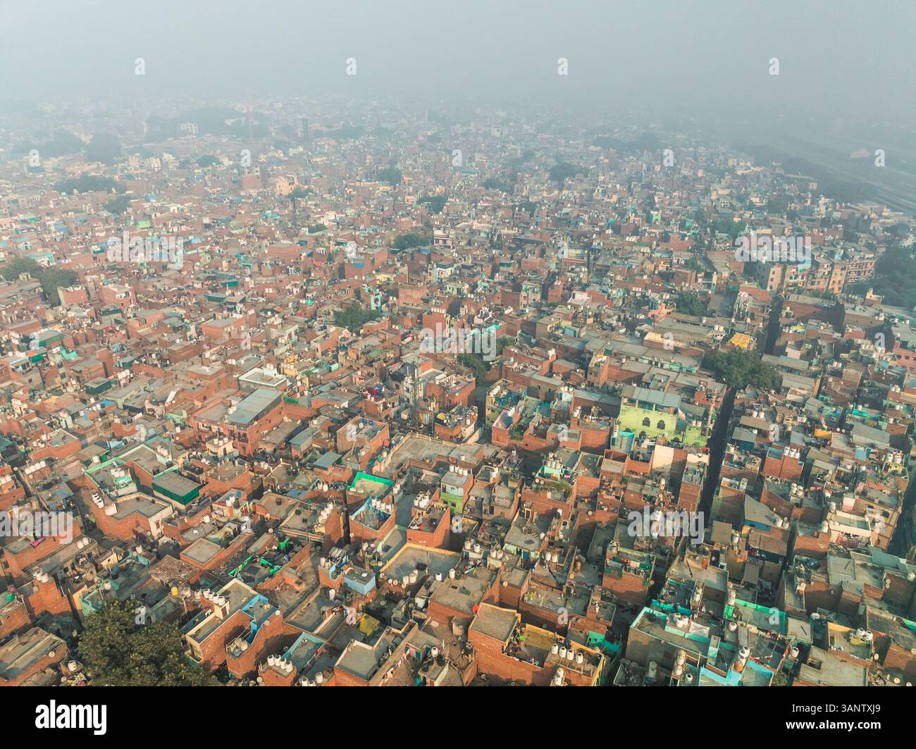 Aerial view of dense urban residential buildings and rooftops in a ...