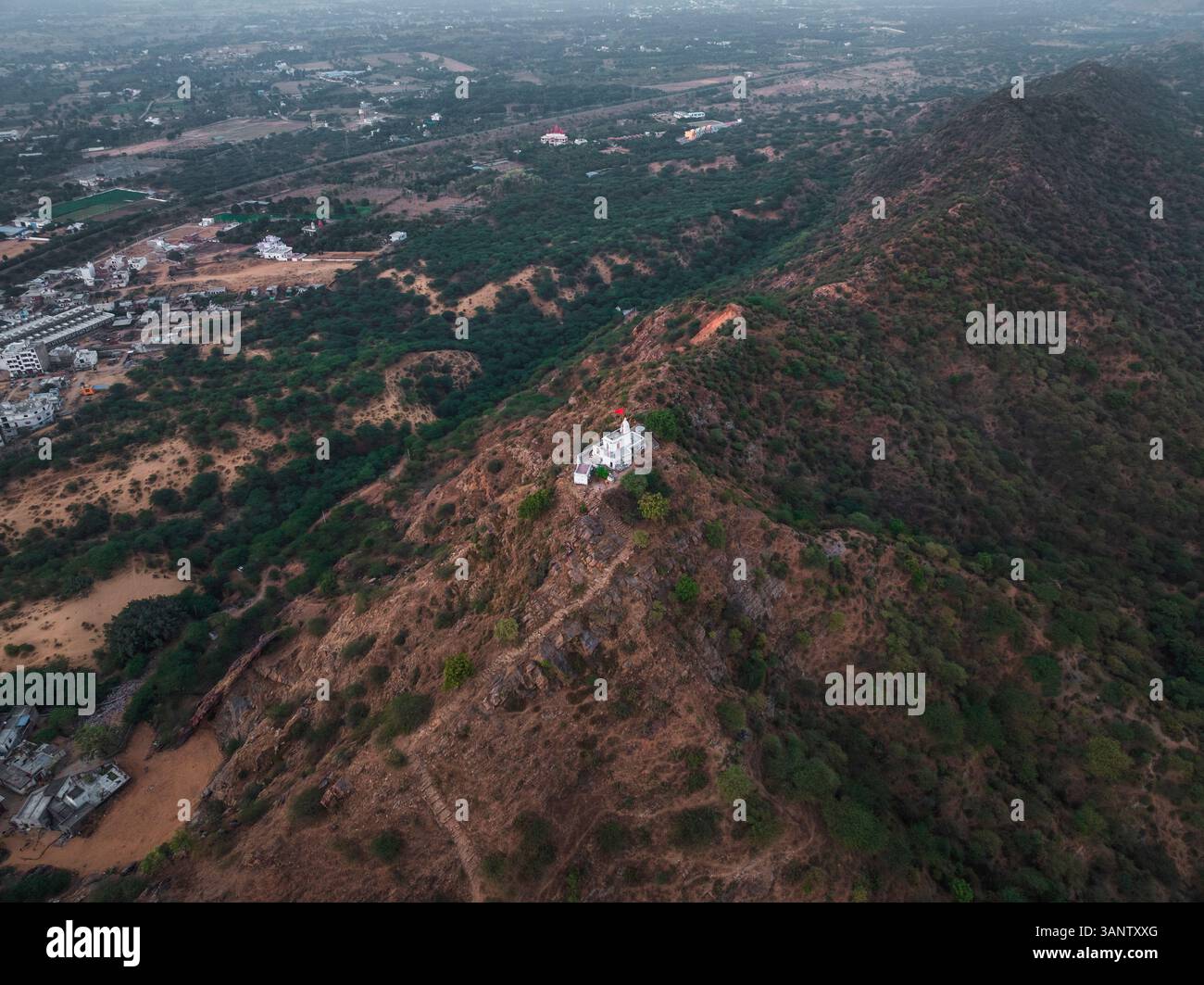 Aerial view of the majestic Gayatri Mata Temple surrounded by serene ...