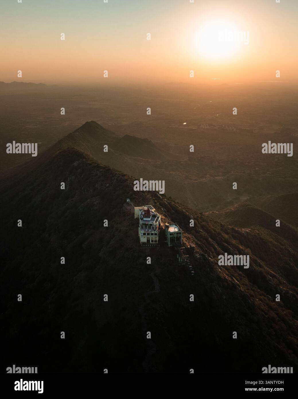 Aerial view of Shree Savitri Mata Temple on a mountain during sunset ...
