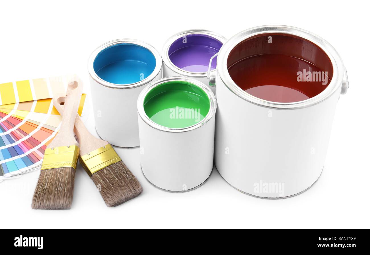 Cans of bright paints, brushes and color palettes isolated on white ...