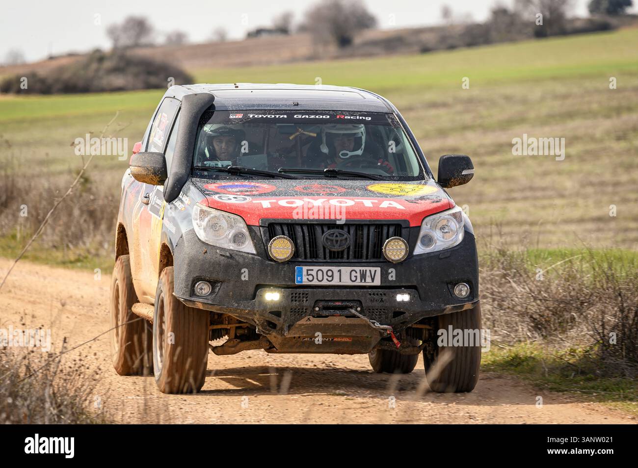 Madrid, Spain; 02-15-2025: A Toyota Land Cruiser races on a rugged dirt ...