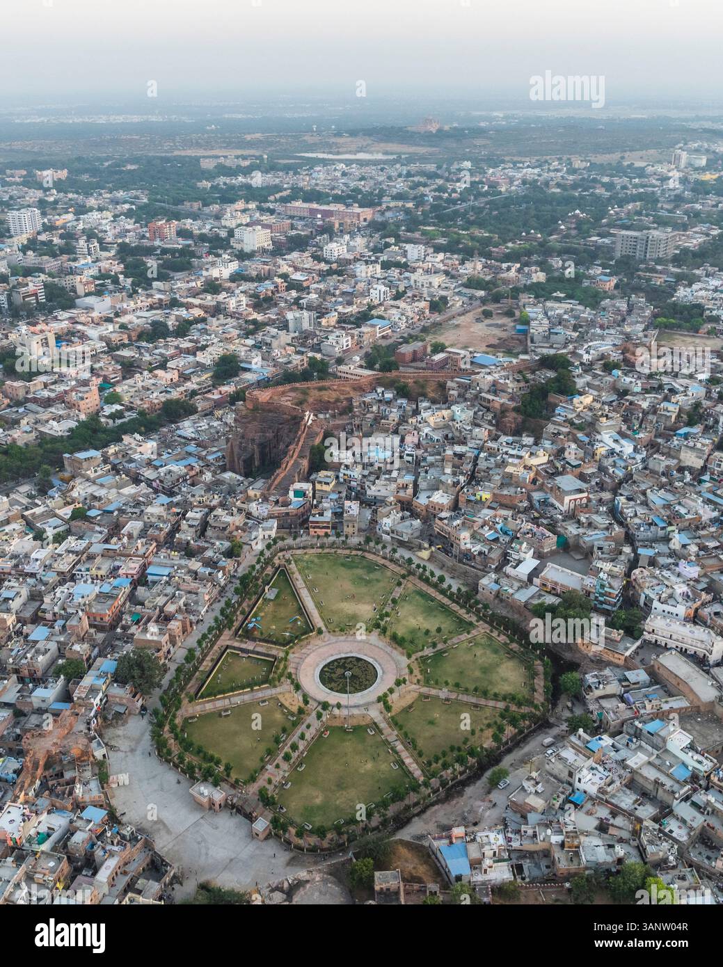 Aerial view of beautiful cityscape with dense buildings and green parks ...