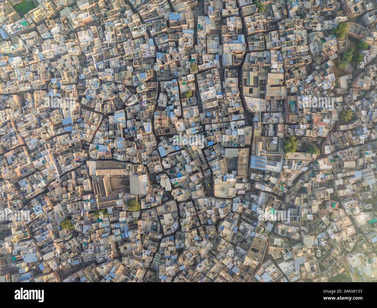 Aerial view of vibrant maze-like cityscape with intricate rooftops and ...