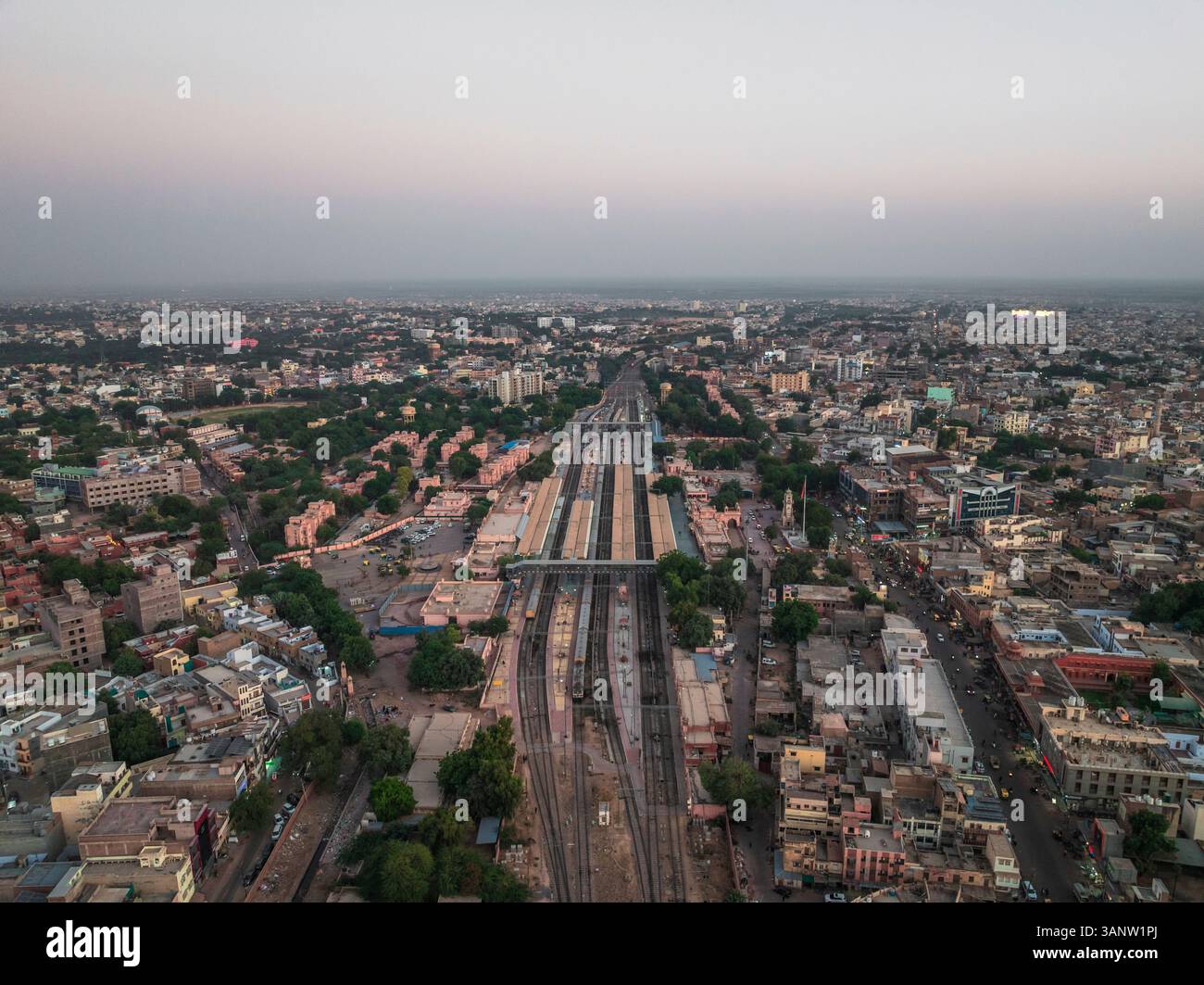 Aerial view of bustling cityscape with railway and train station, Kote ...