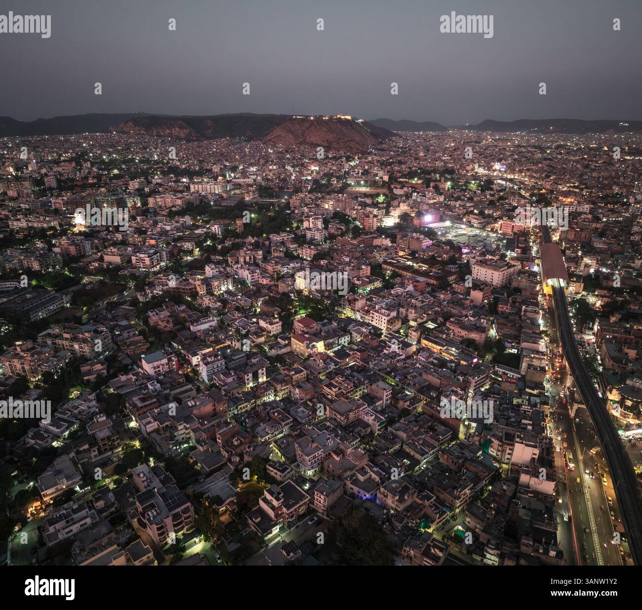 Aerial view of vibrant cityscape with illuminated buildings and busy ...