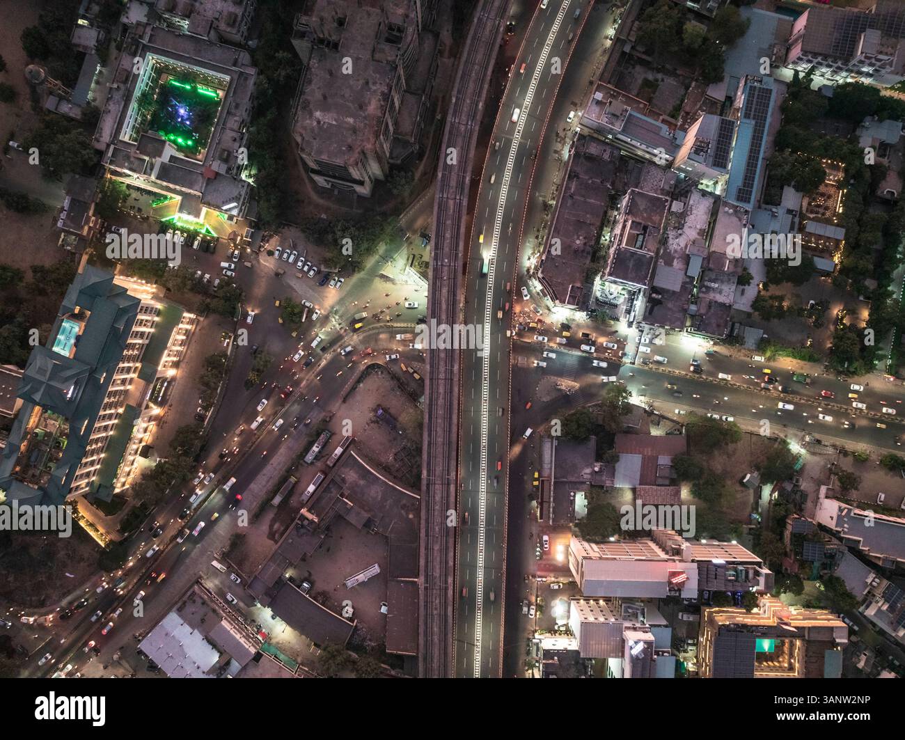 Aerial view of bustling cityscape with vibrant lights and busy traffic ...