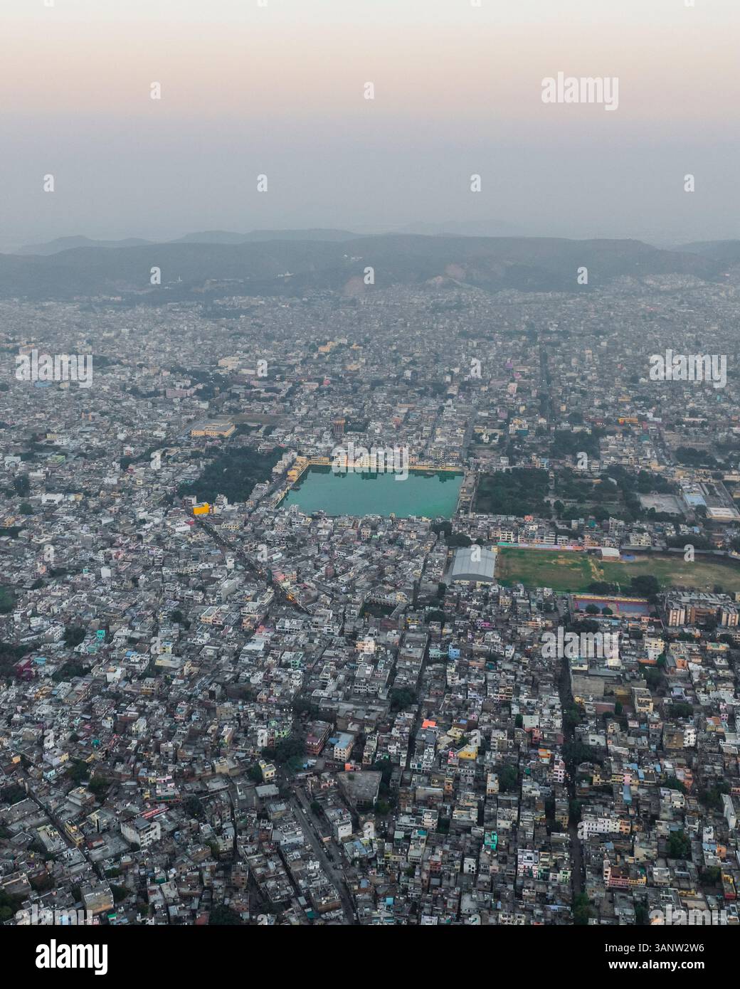 Aerial view of vibrant cityscape with Tal Katora Lake and bustling ...