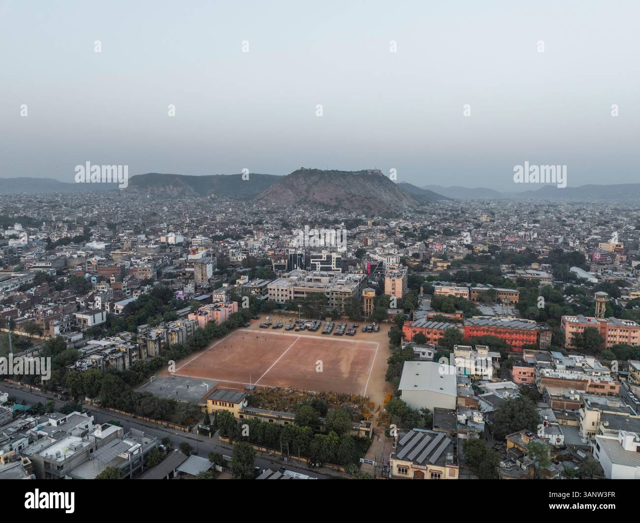 Aerial view of a vibrant and expansive cityscape with colorful rooftops ...