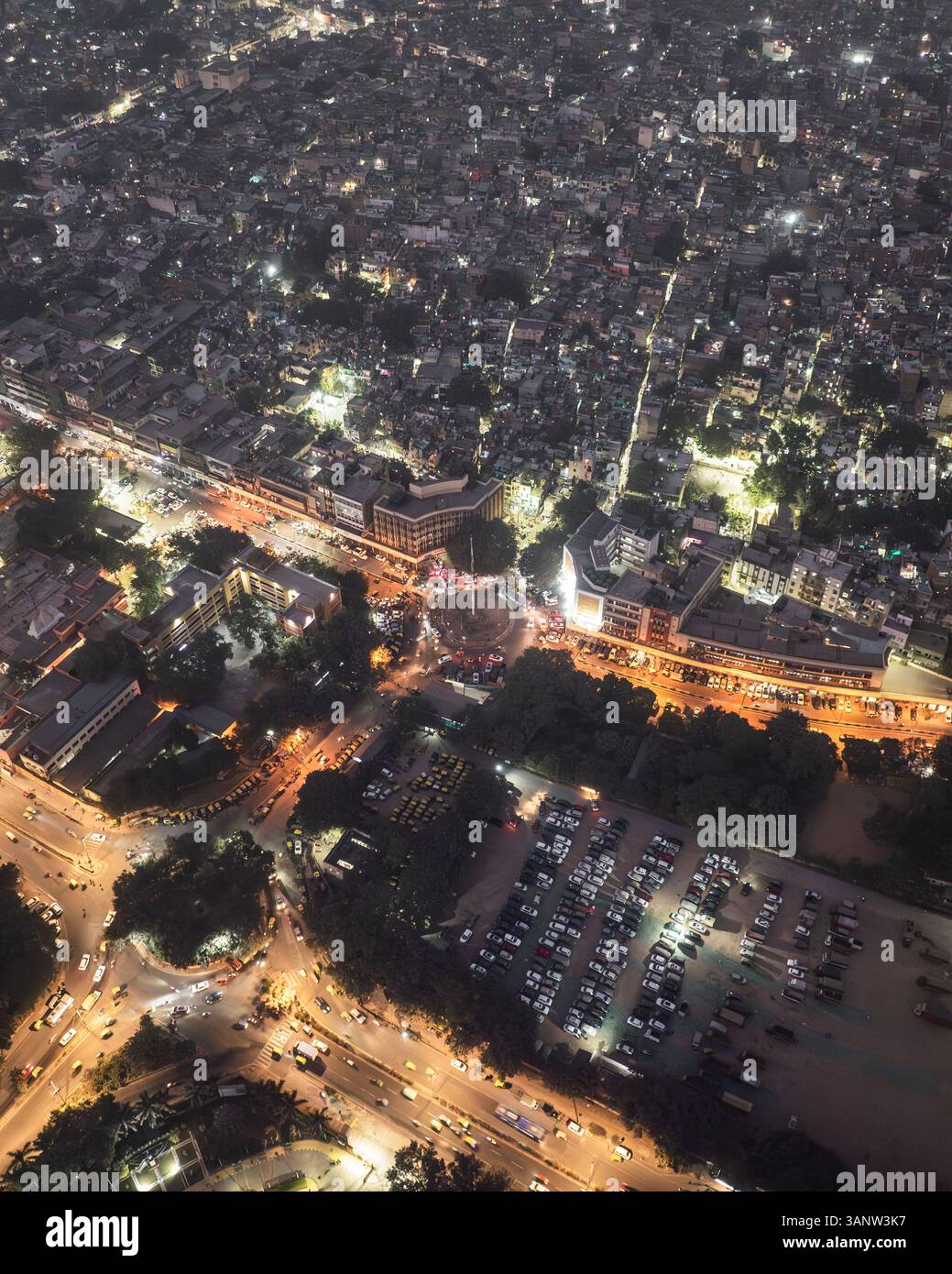 Aerial view of a vibrant and bustling roundabout with illuminated ...