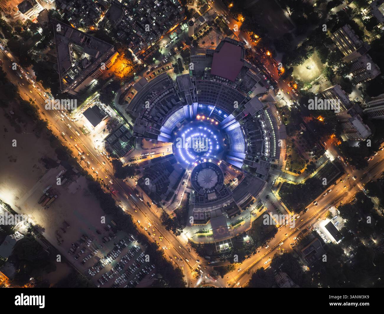 Aerial view of vibrant cityscape with bustling traffic and illuminated ...