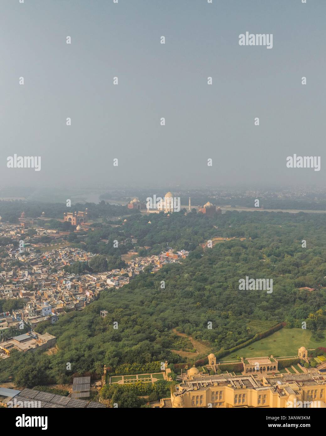 Aerial view of the iconic Taj Mahal surrounded by greenery and ...