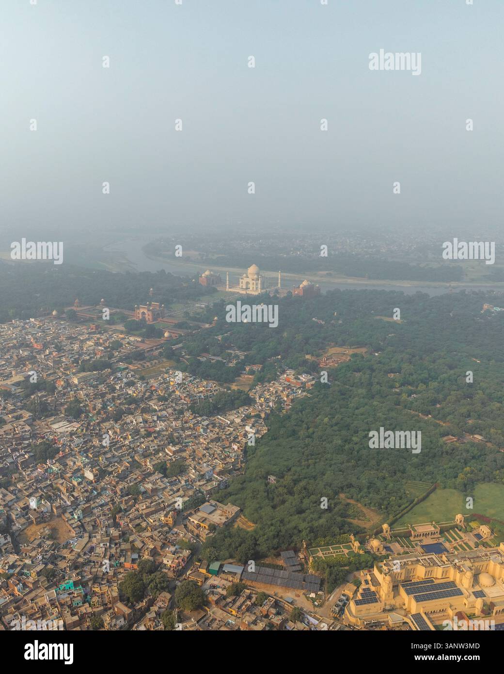 Aerial view of the iconic Taj Mahal surrounded by urban landscape and ...