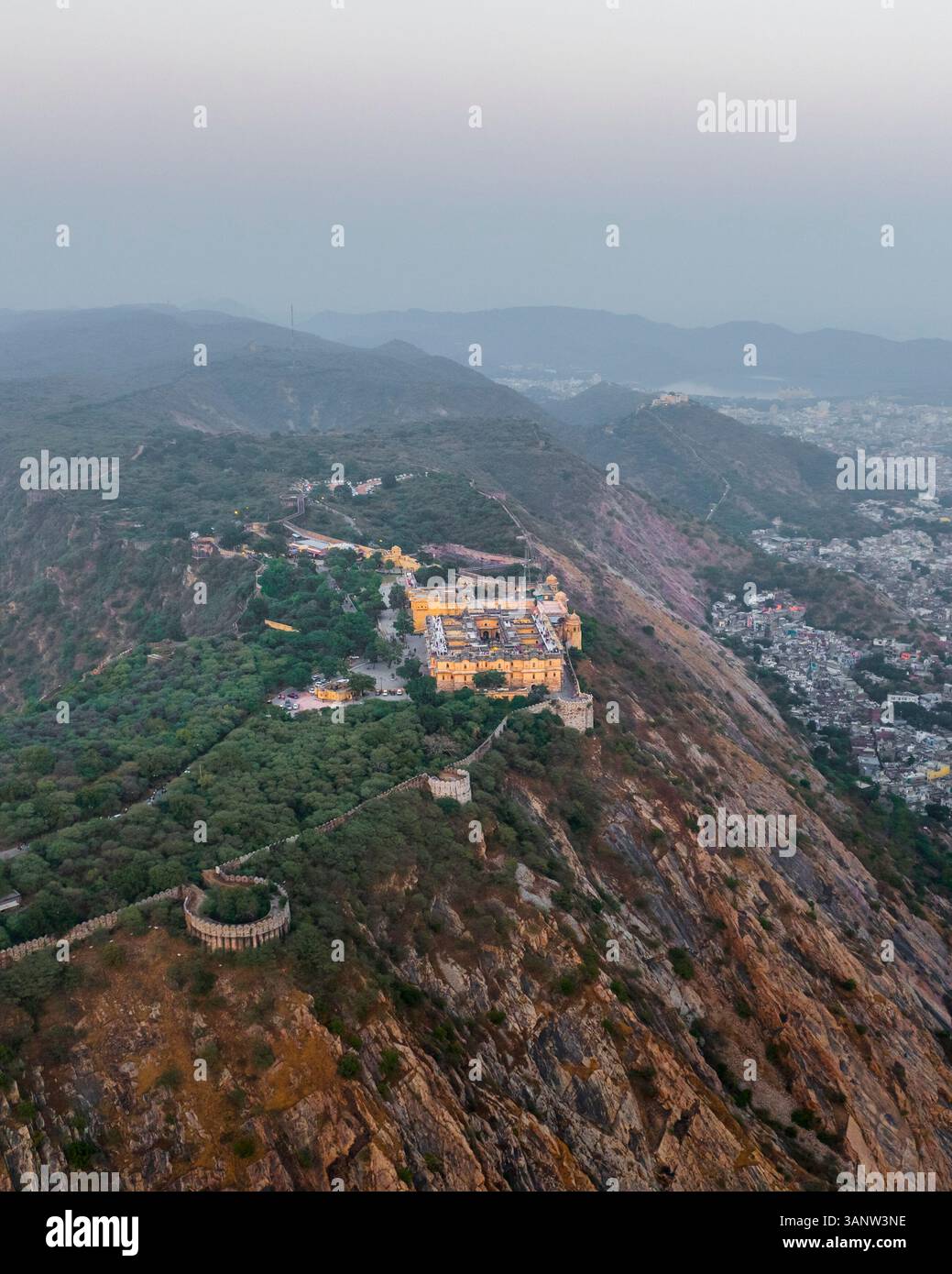 Aerial view of nahargarh fort on a hilltop surrounded by greenery and ...