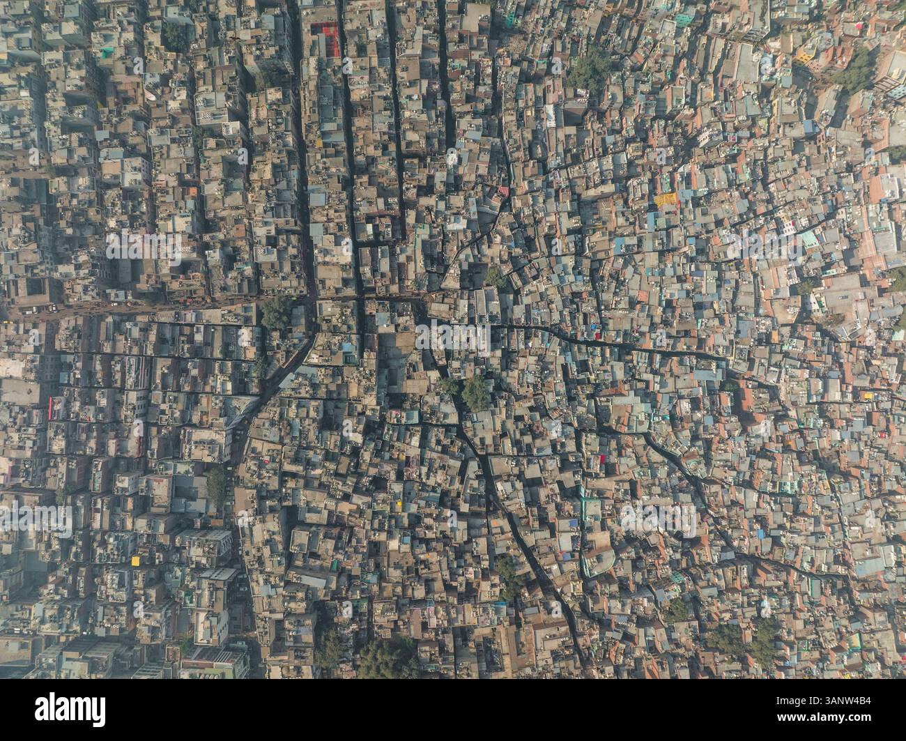 Aerial view of dense urban rooftops and crowded streets in Paharganj ...