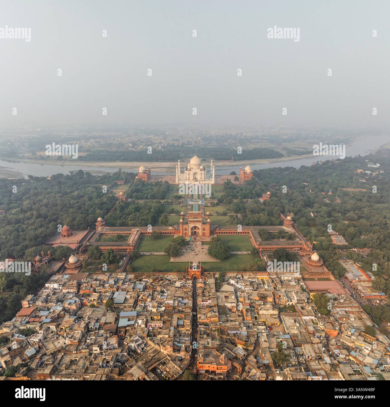 Aerial view of the iconic Taj Mahal surrounded by gardens and a river ...