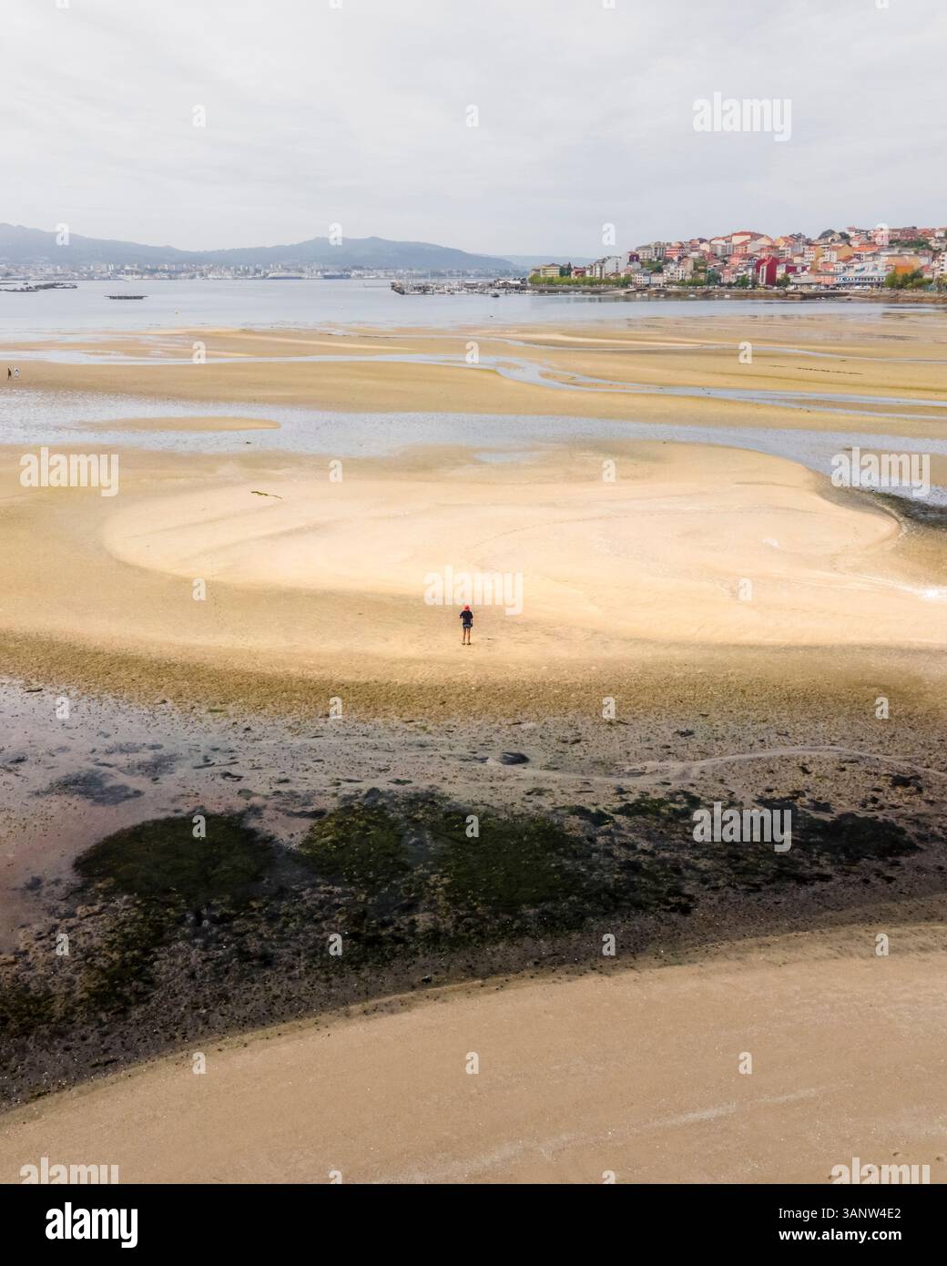 Aerial view of a beautiful sandy beach with tranquil waves and a serene ...